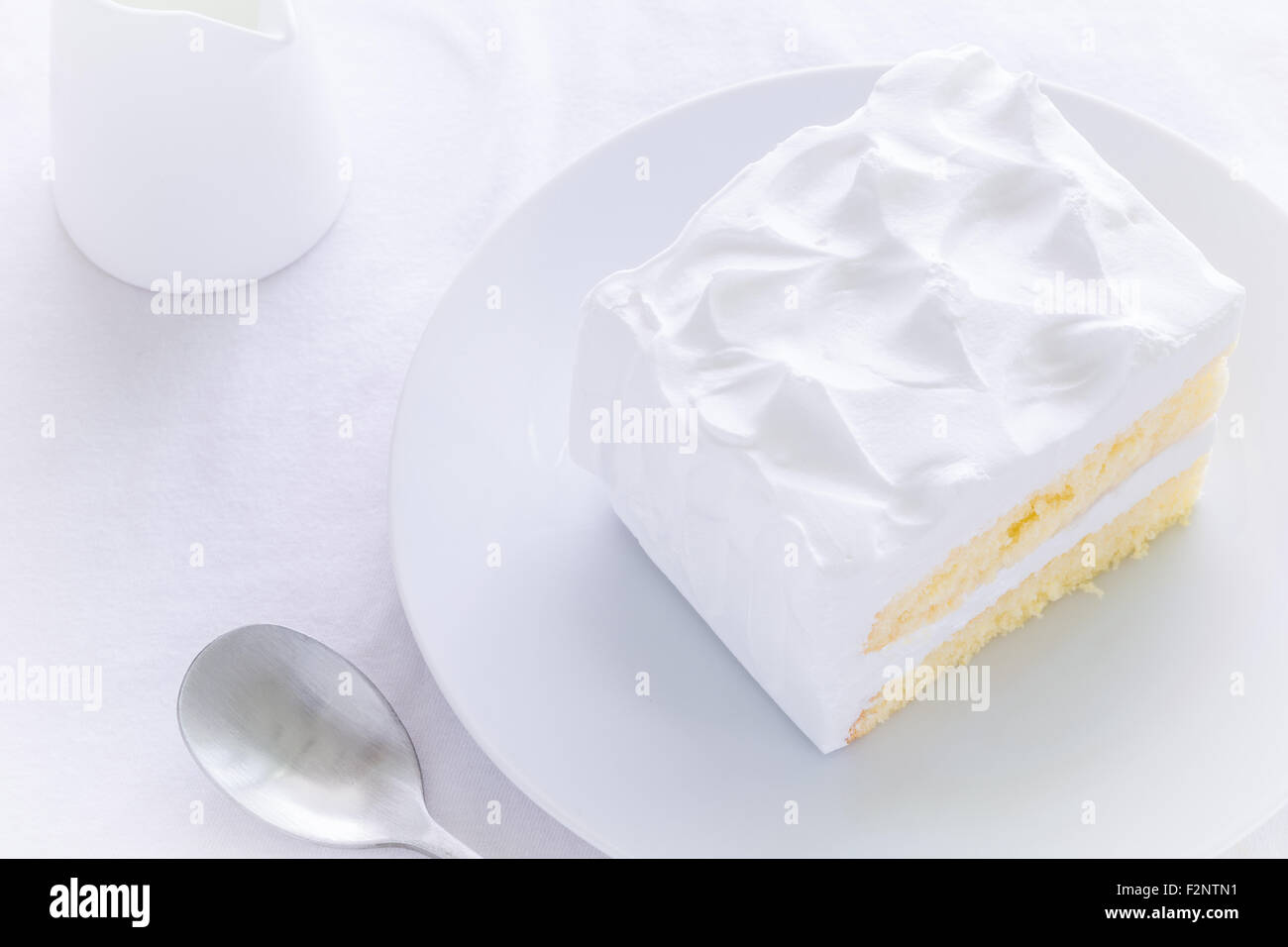 White cake for tea break moment on white background Stock Photo - Alamy