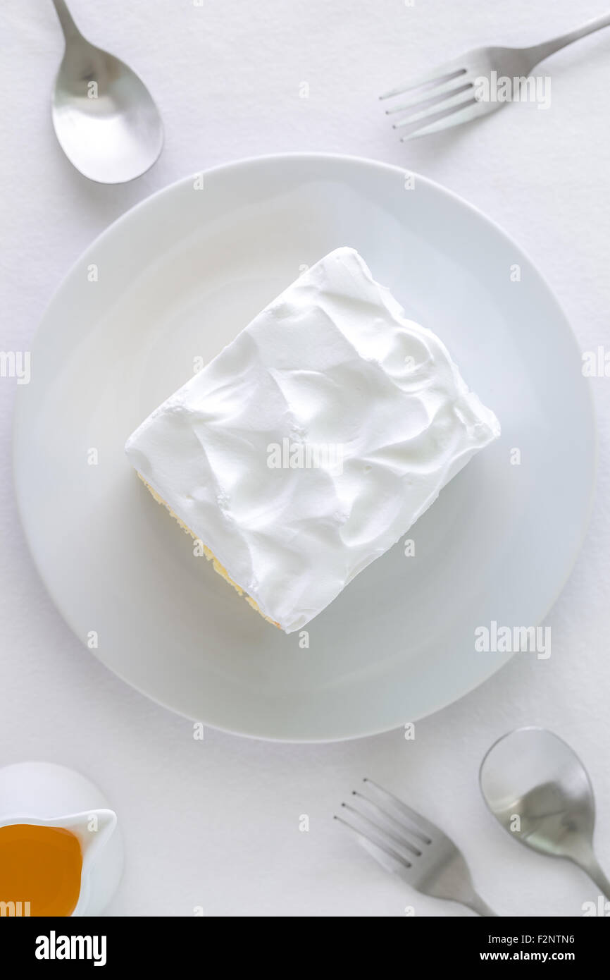 White cake for tea break moment on white background Stock Photo - Alamy