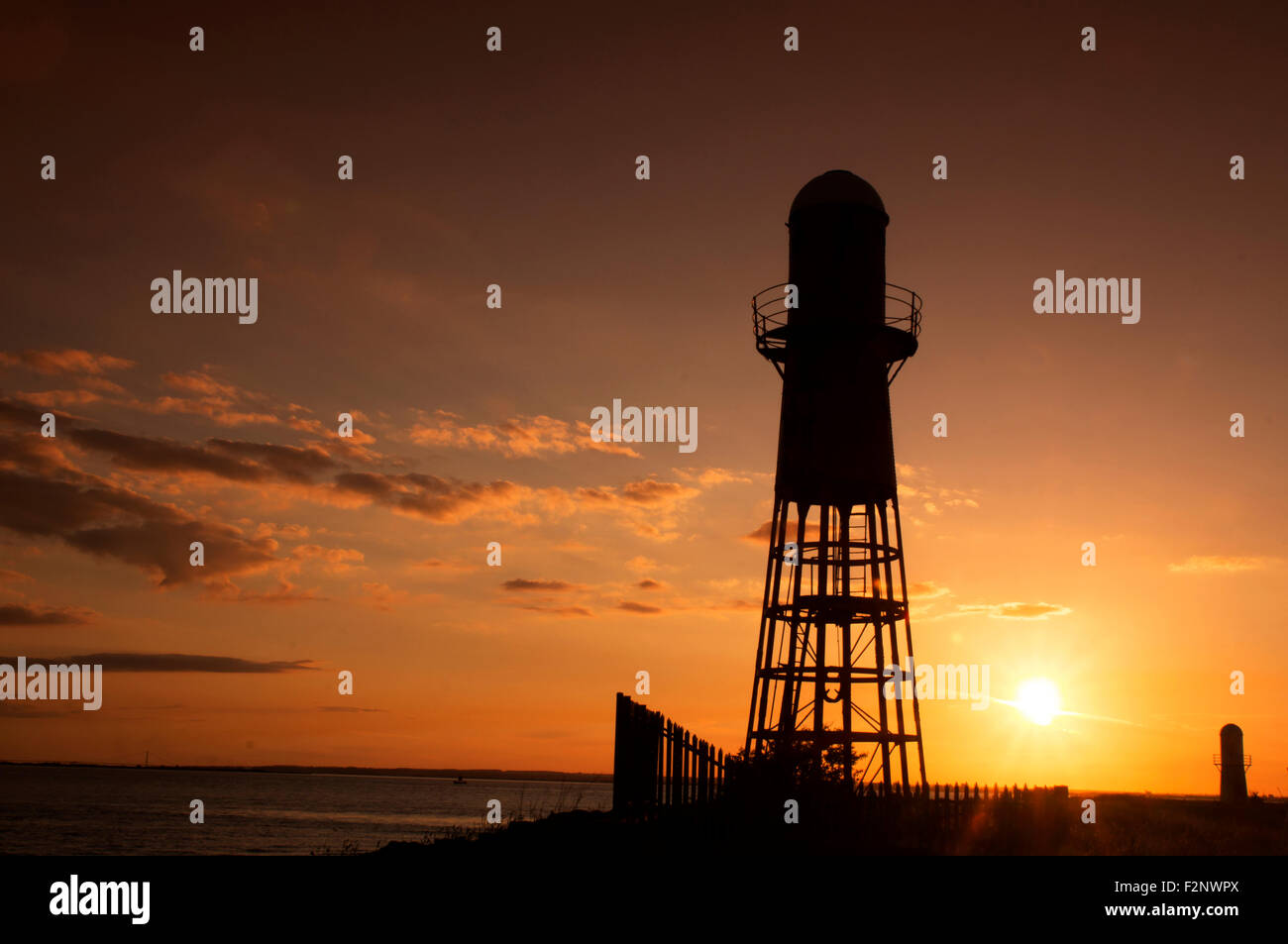 Lighthouse at sunset Stock Photo - Alamy