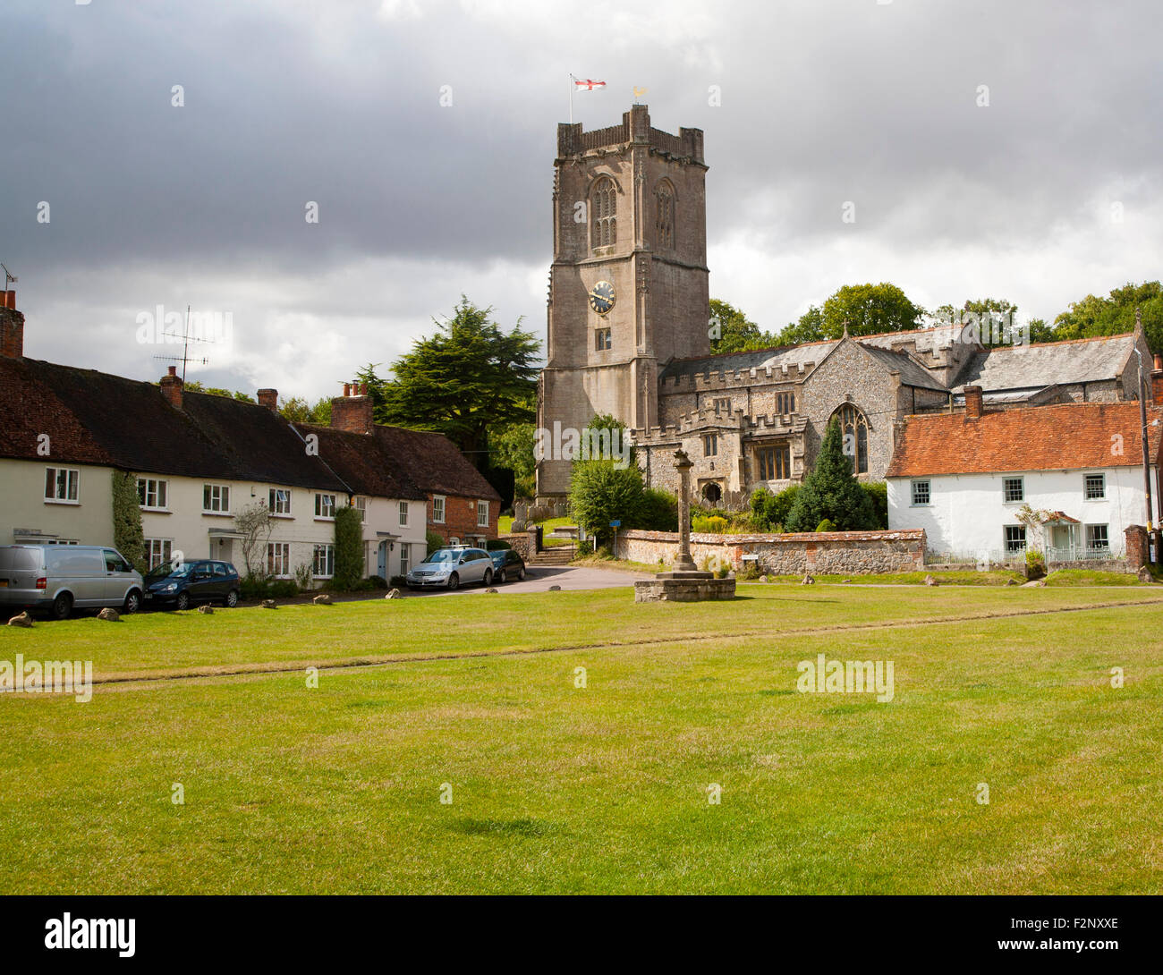 Church of St Michael and butter cross on the village green in Aldbourne ...