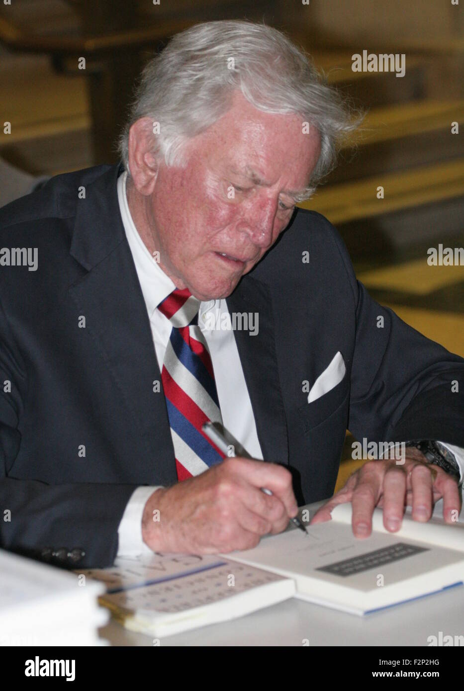 Former American senator and author Gary Hart signs copies of his book ...
