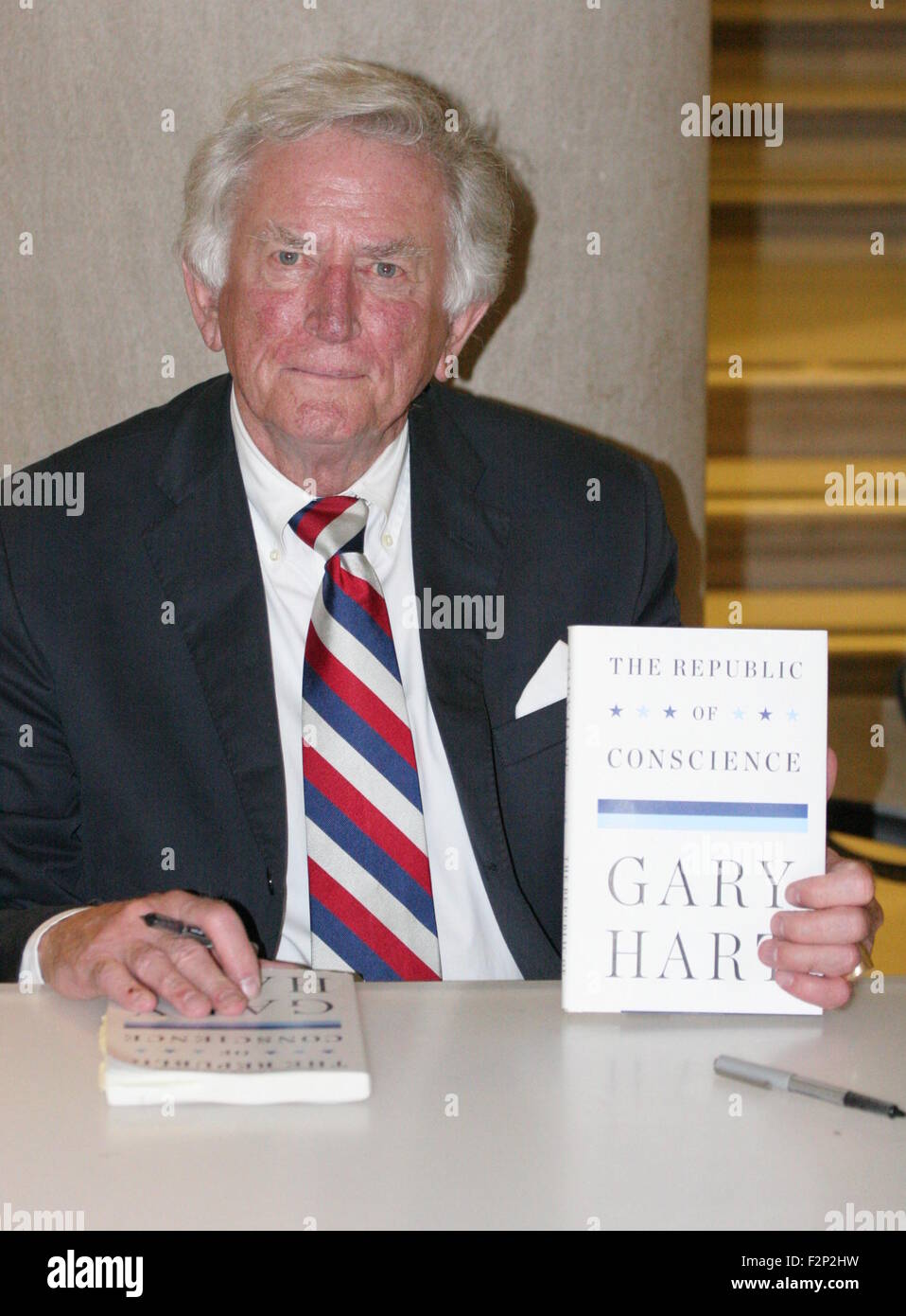 Former American senator and author Gary Hart signs copies of his book ...