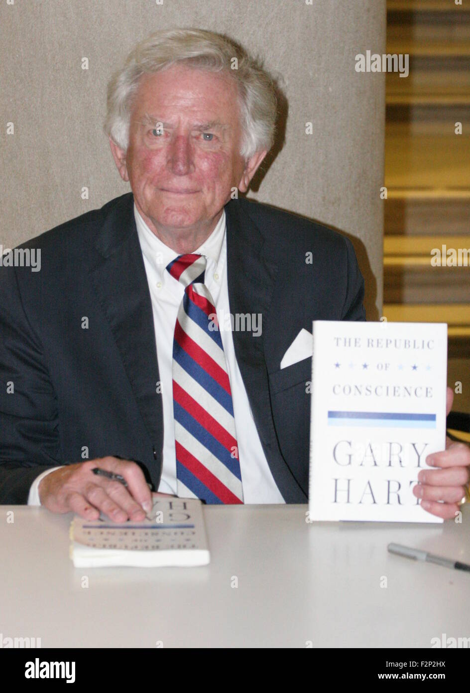 Former American senator and author Gary Hart signs copies of his book ...