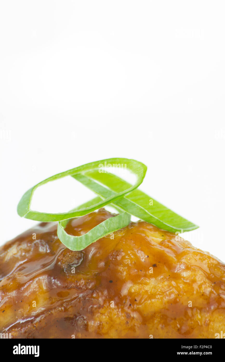 Fried chicken wing sprinkled with chives isolated on white Stock Photo ...