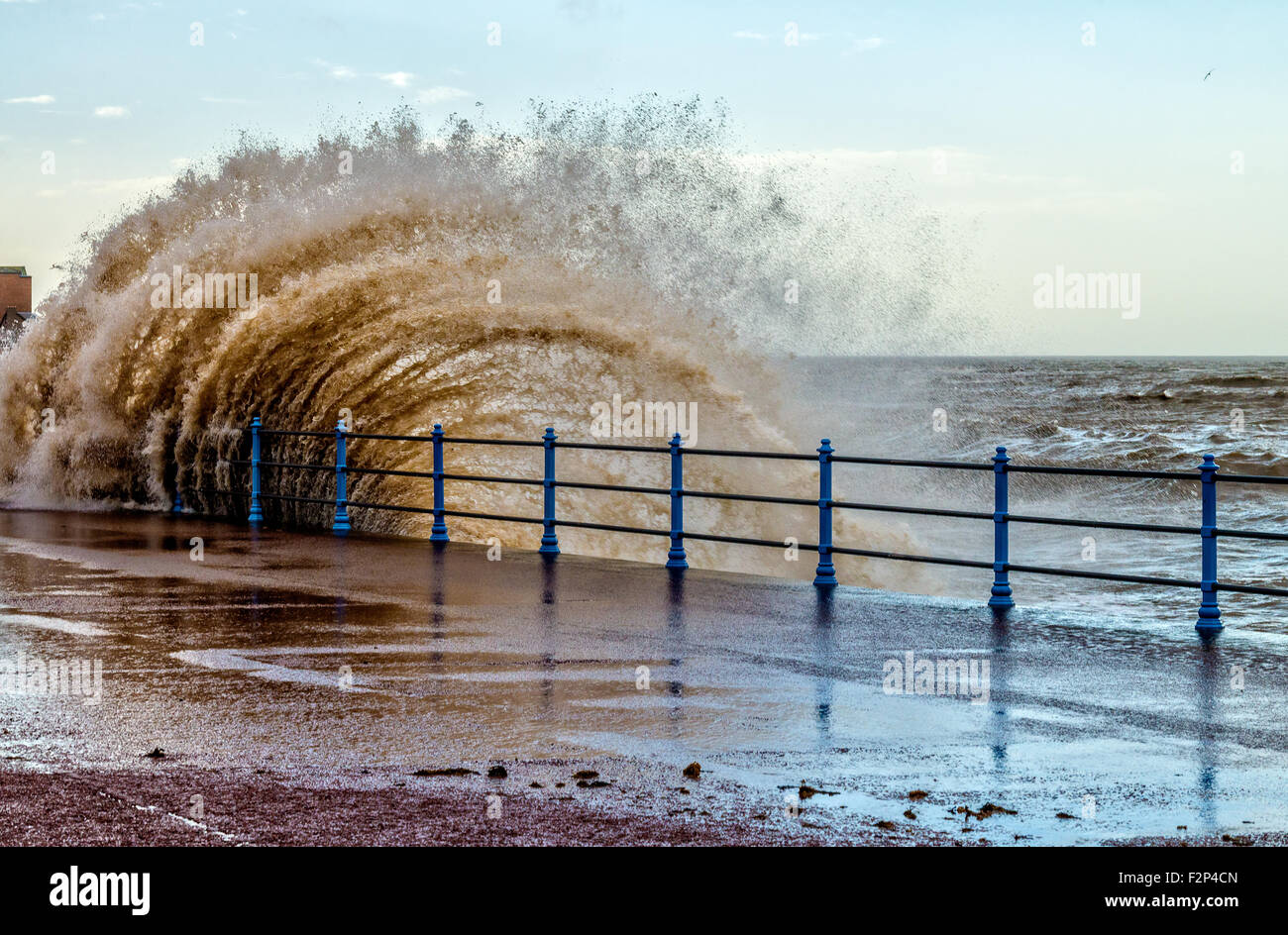 Wave breaking onto promenade Stock Photo - Alamy