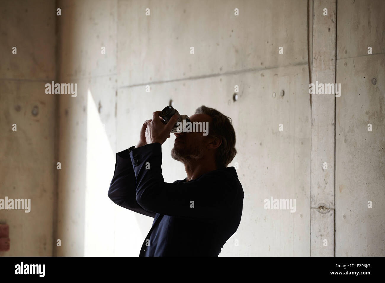 Man taking picture on construction site Stock Photo - Alamy