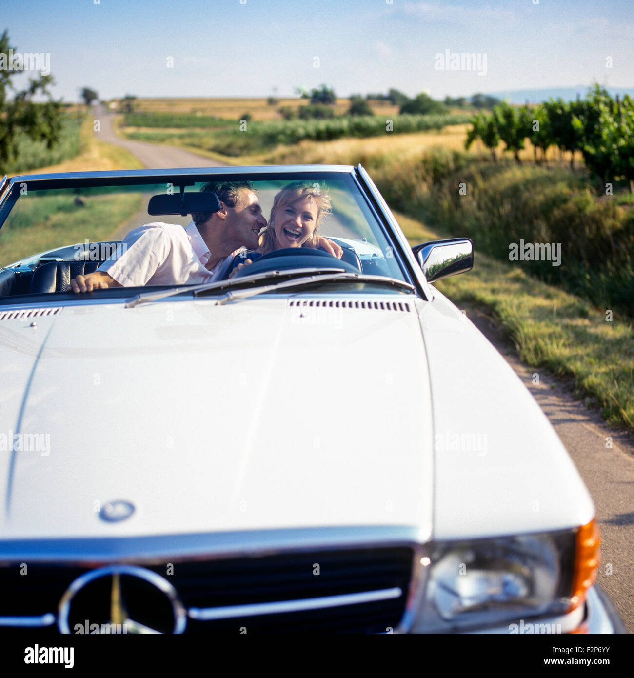 Man driving white mercedes convertible car hi-res stock photography and ...