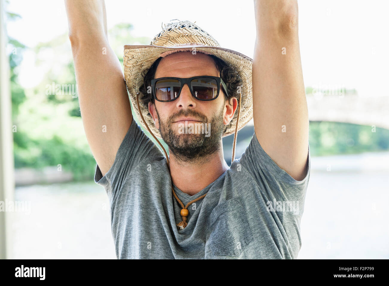 Portrait of man wearing straw hat and sunglasses Stock Photo - Alamy