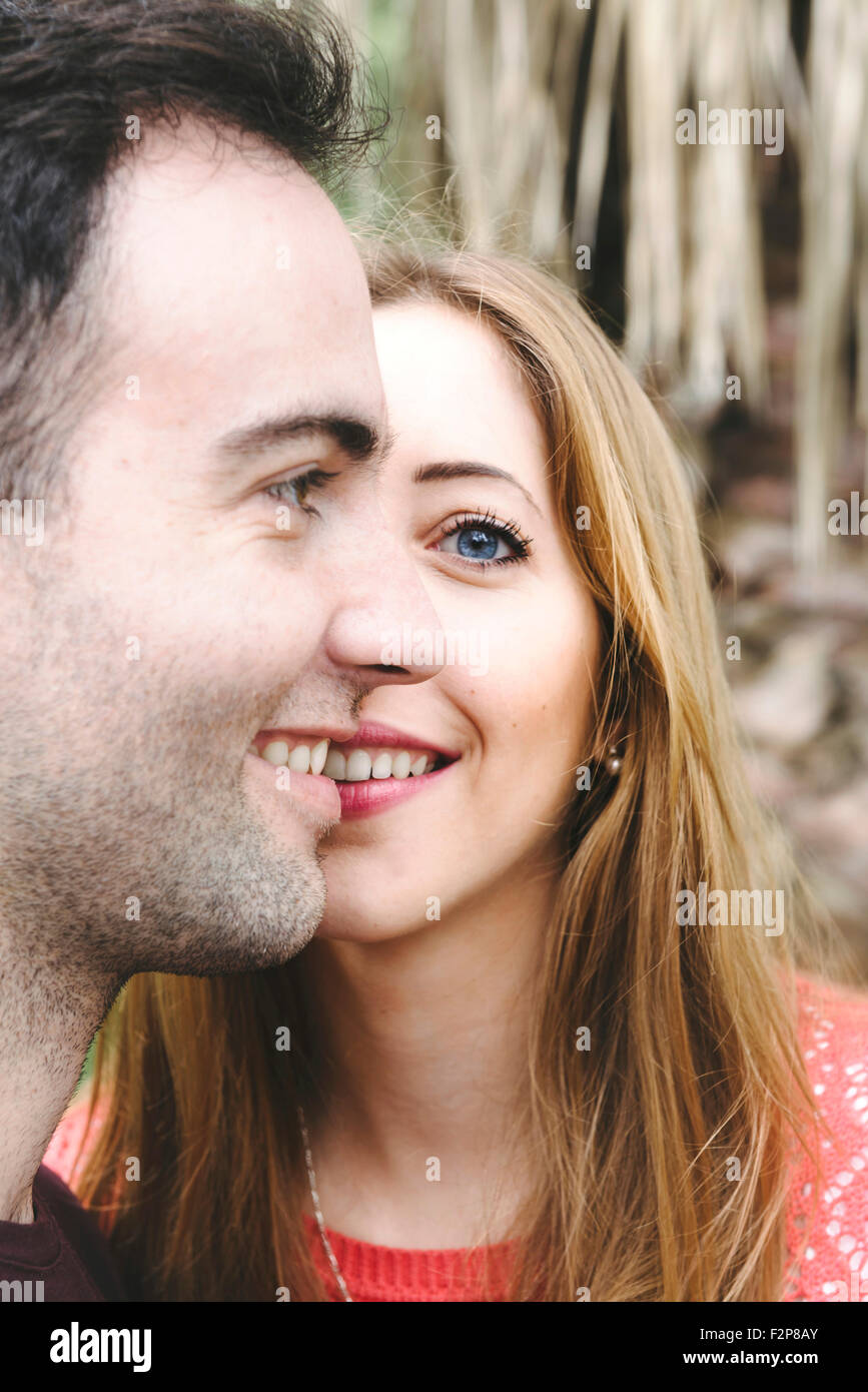 Portrait of a couple building together one face Stock Photo - Alamy