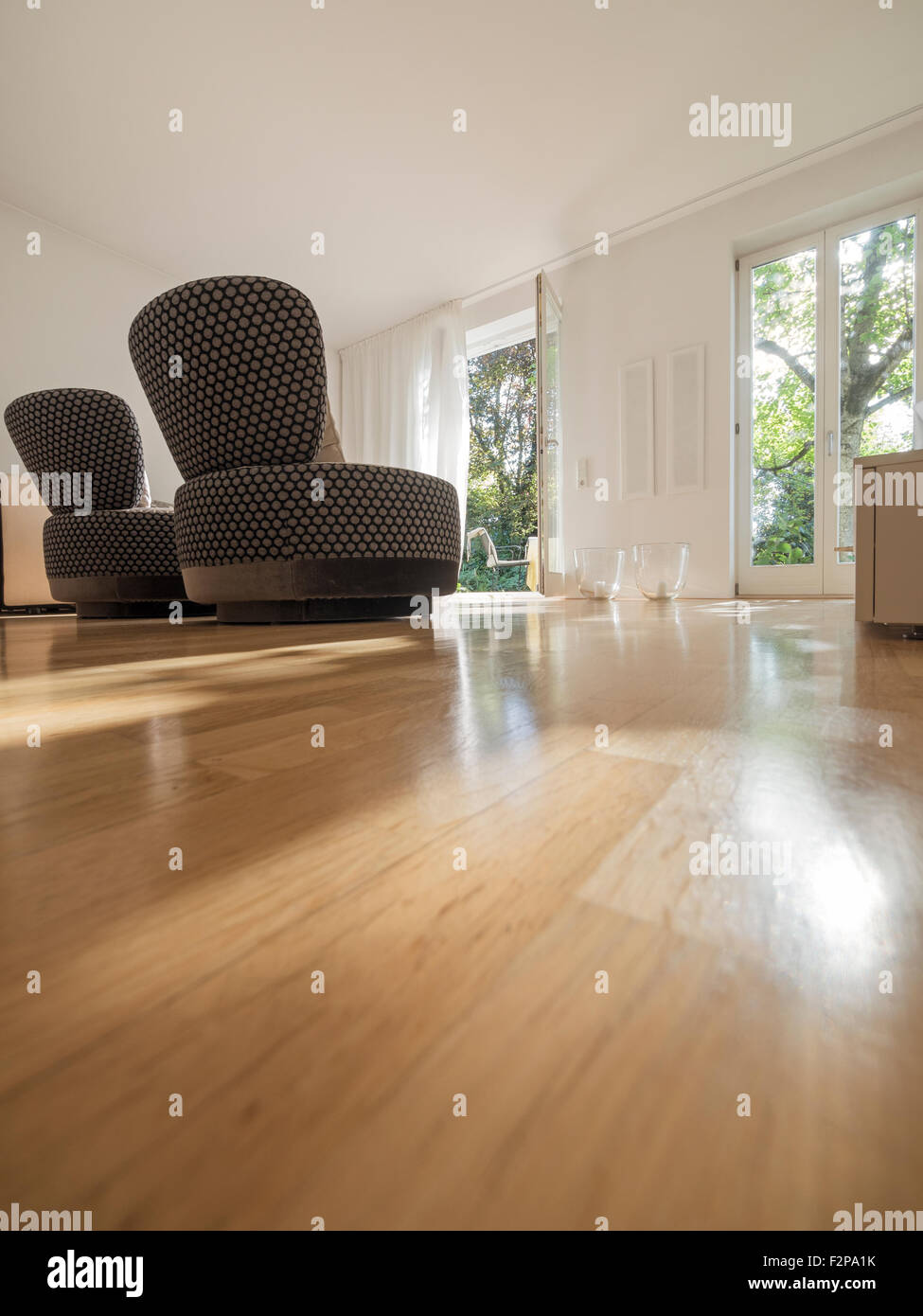 Modern living room with two armchairs Stock Photo - Alamy