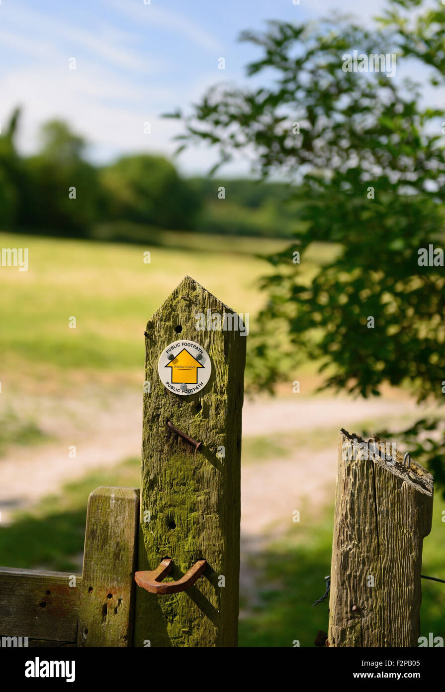 A yellow waymarker on a post Stock Photo - Alamy