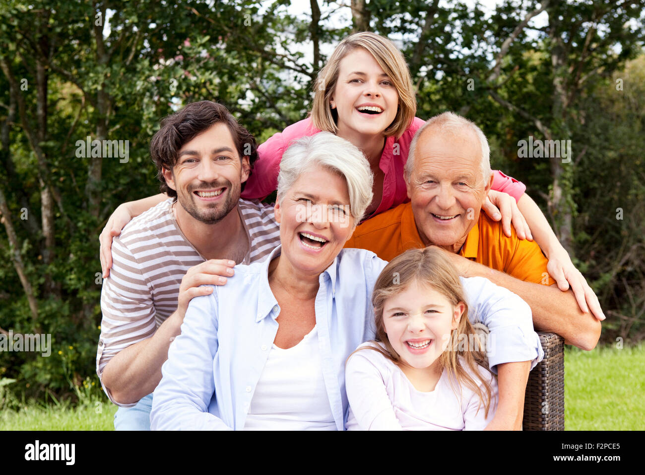 Portrait of happy extended family outdoors Stock Photo - Alamy