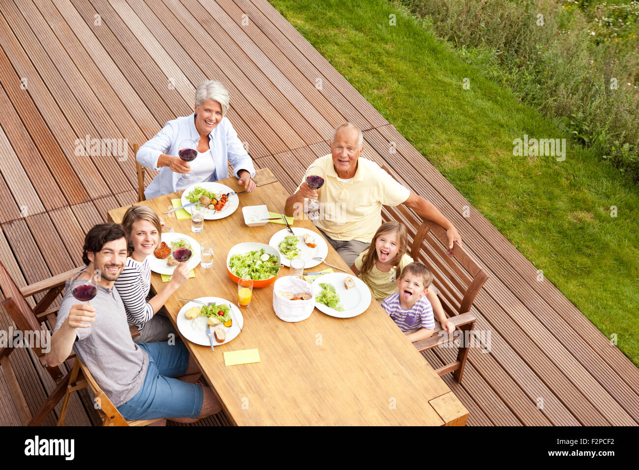 Happy Extended Family Having Garden Party High Resolution Stock ...