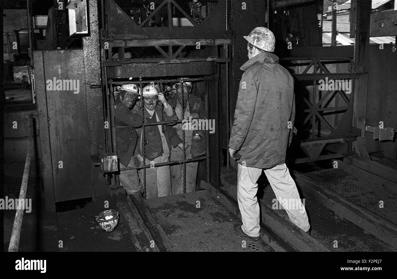 Miners emerging in the cage after completing a shift on the coal face ...