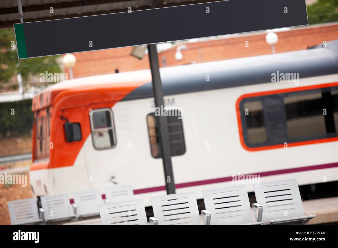 Railway station blanket signpost with out of focus train Stock Photo ...