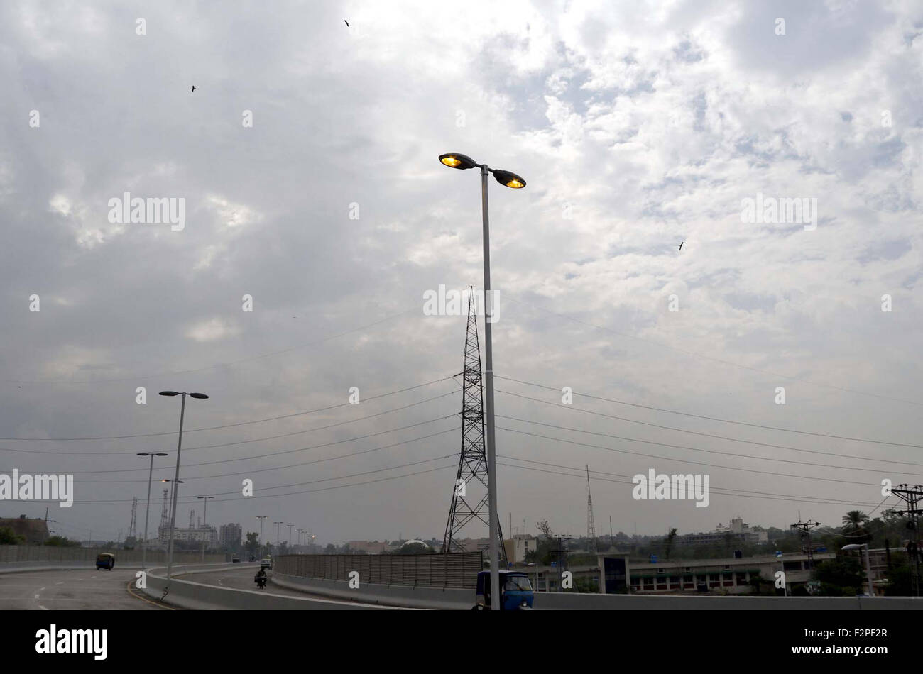 Street lights are seen on in day time at Mufti Mahmood flyover showing ...