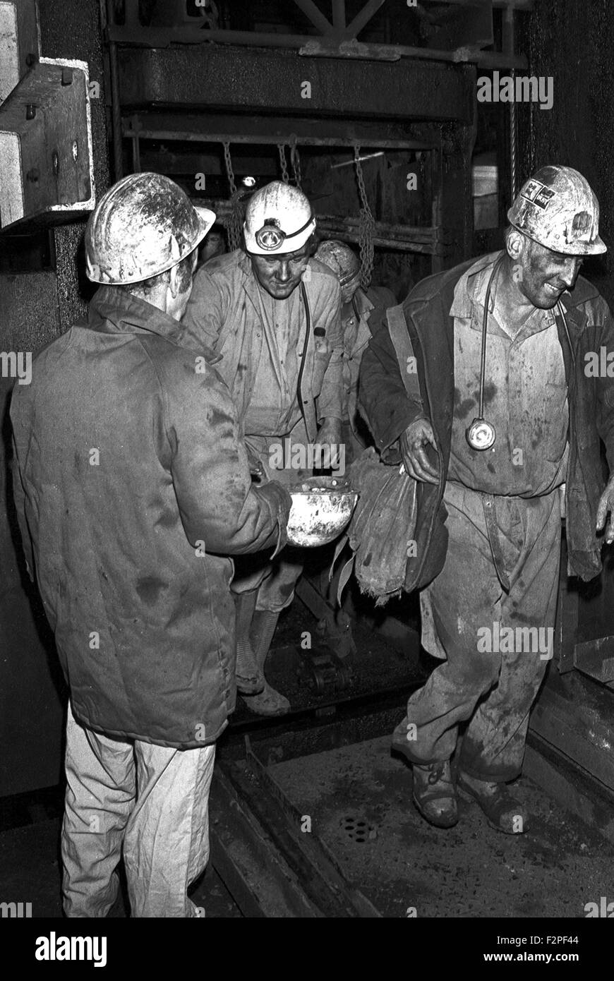 Miners emerging in the cage after completing a shift on the coal face ...