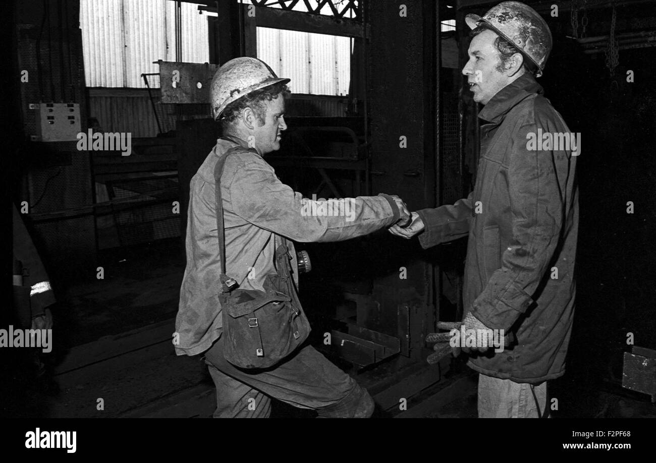 Miners emerging in the cage after completing a shift on the coal face ...