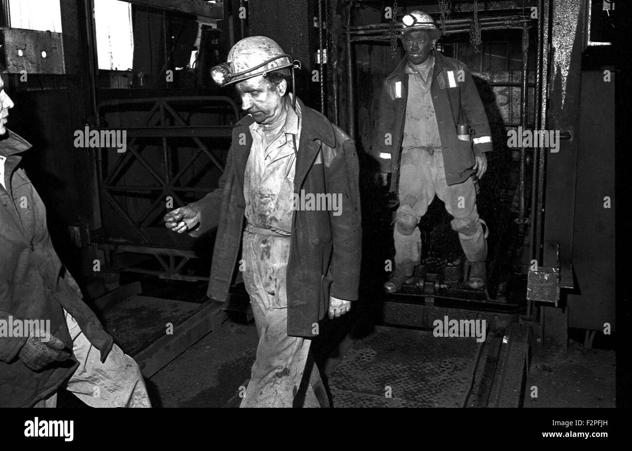 Miners emerging in the cage after completing a shift on the coal face ...