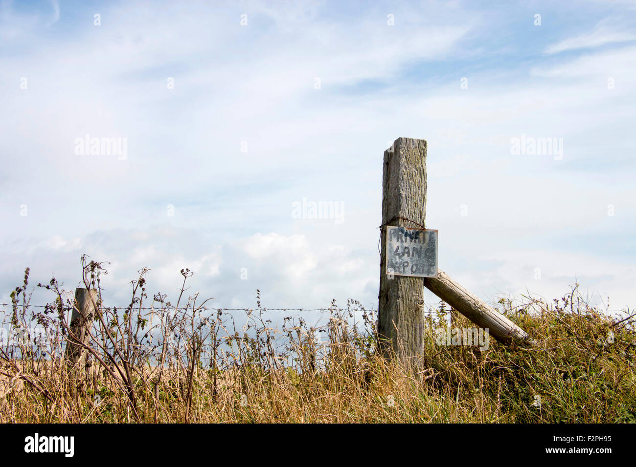 Private land sign on post Stock Photo - Alamy