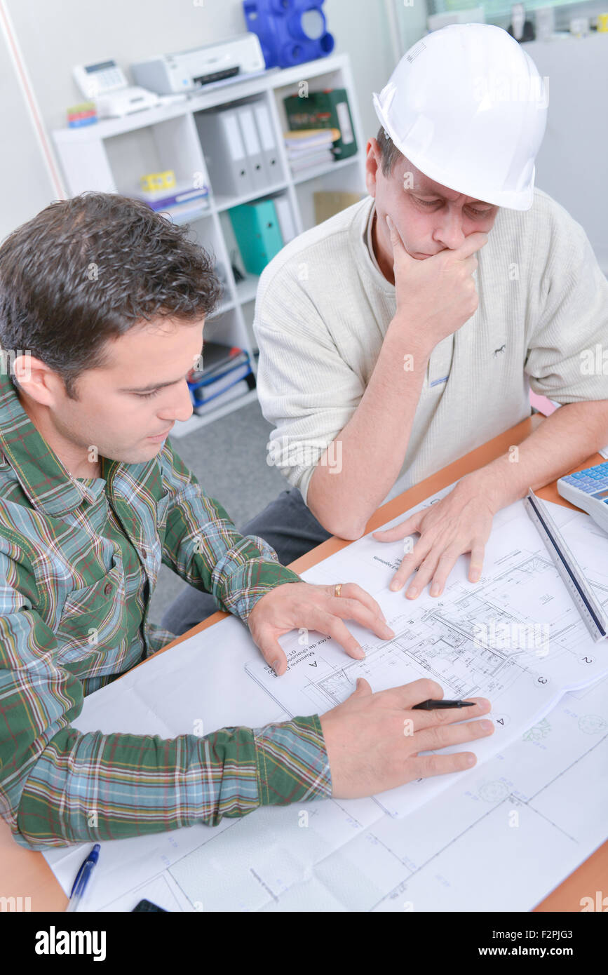 Two men contemplating plans Stock Photo - Alamy