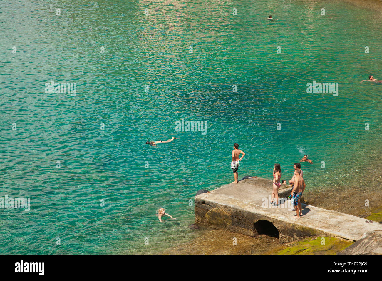 People swimming in the islet of Vila Franca do Campo off the coast of ...