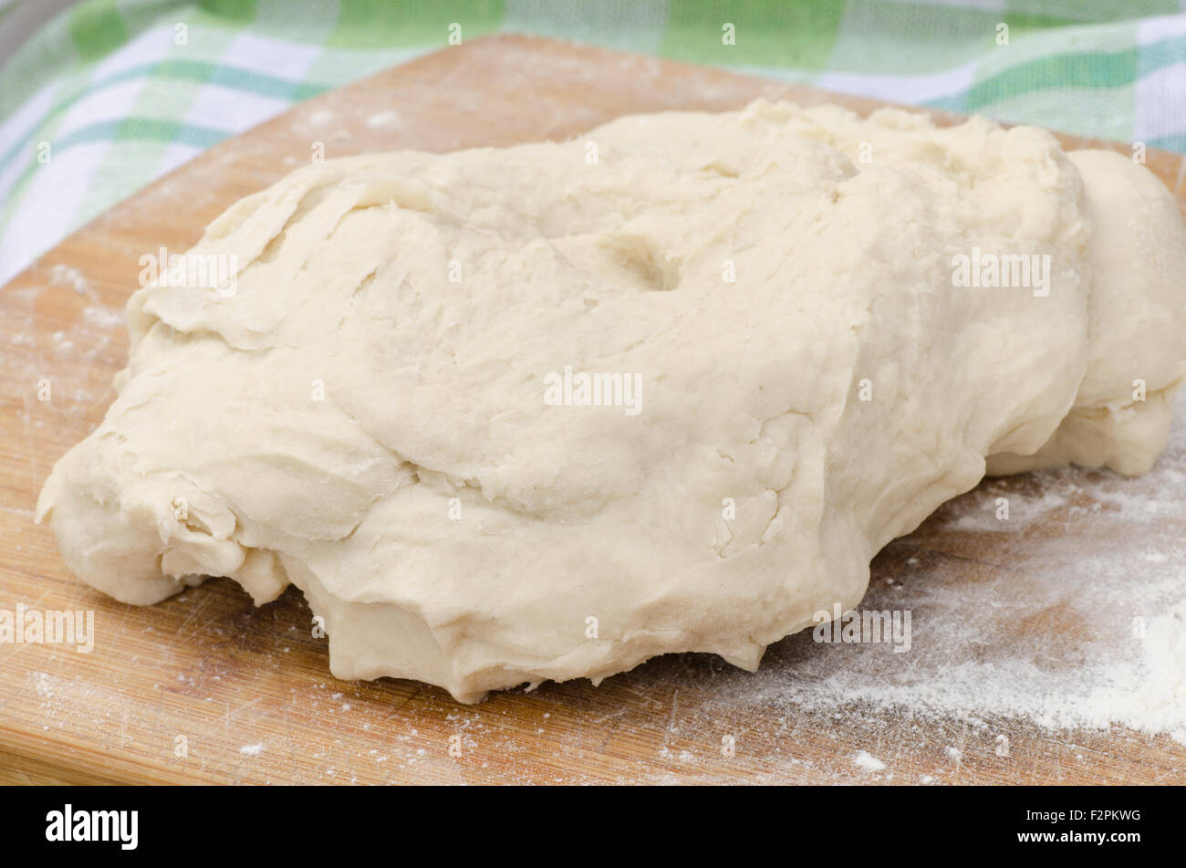 raw dough on wooden pastry board Stock Photo - Alamy