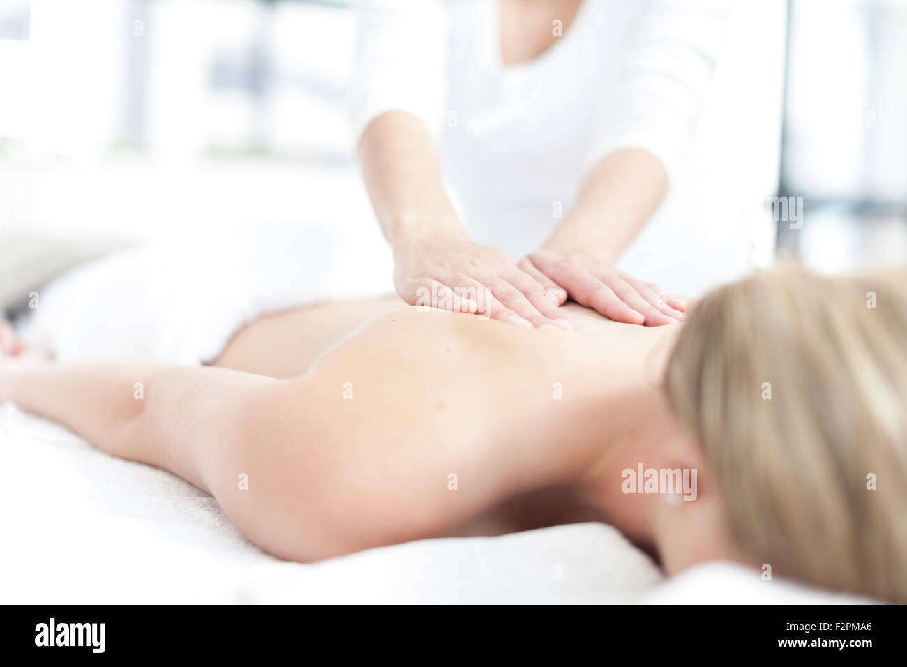 Young woman giving a massage Stock Photo - Alamy