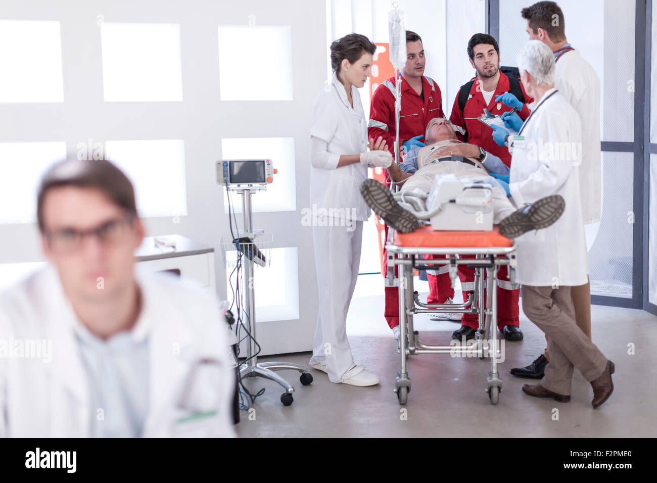 Hospital staff helping patient in emergency Stock Photo - Alamy