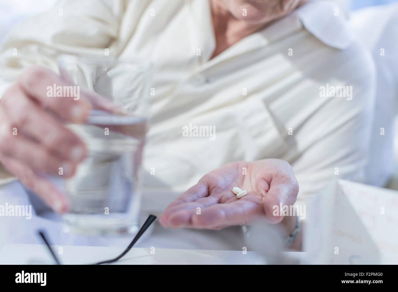 Patient in hospital taking medication Stock Photo - Alamy