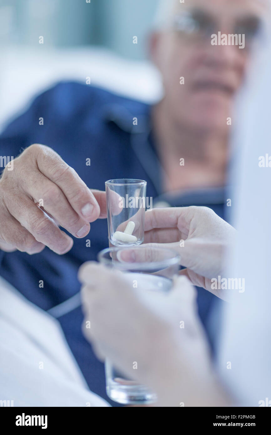Hospital patient receiving medicine Stock Photo - Alamy