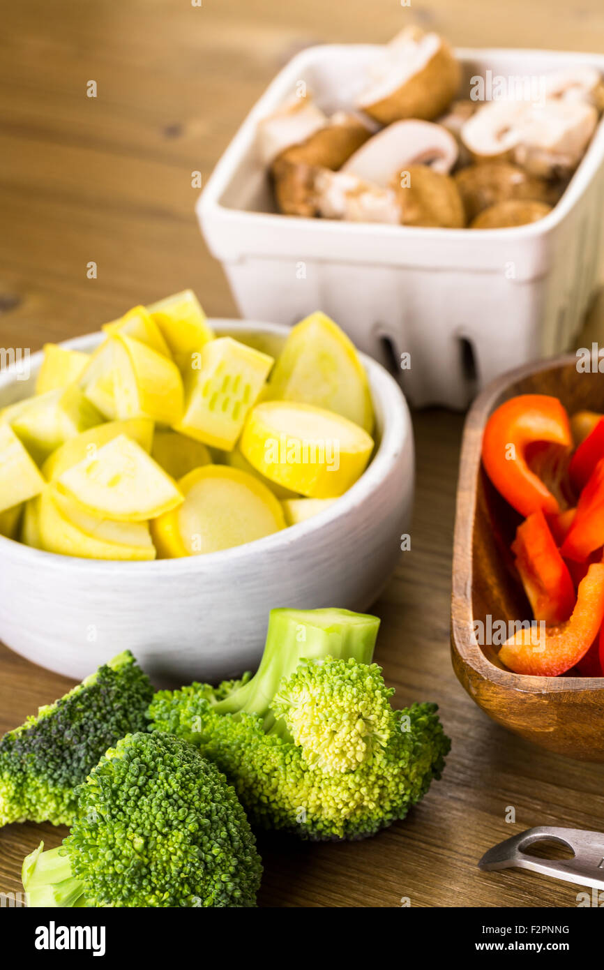 Fresh ingredients for preparing roasted mixed vegetables on the table ...
