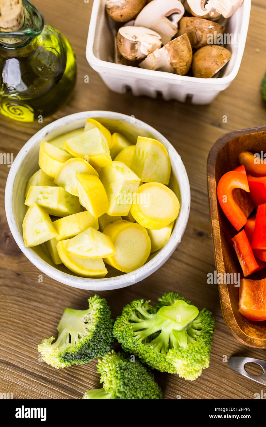 Fresh ingredients for preparing roasted mixed vegetables on the table ...