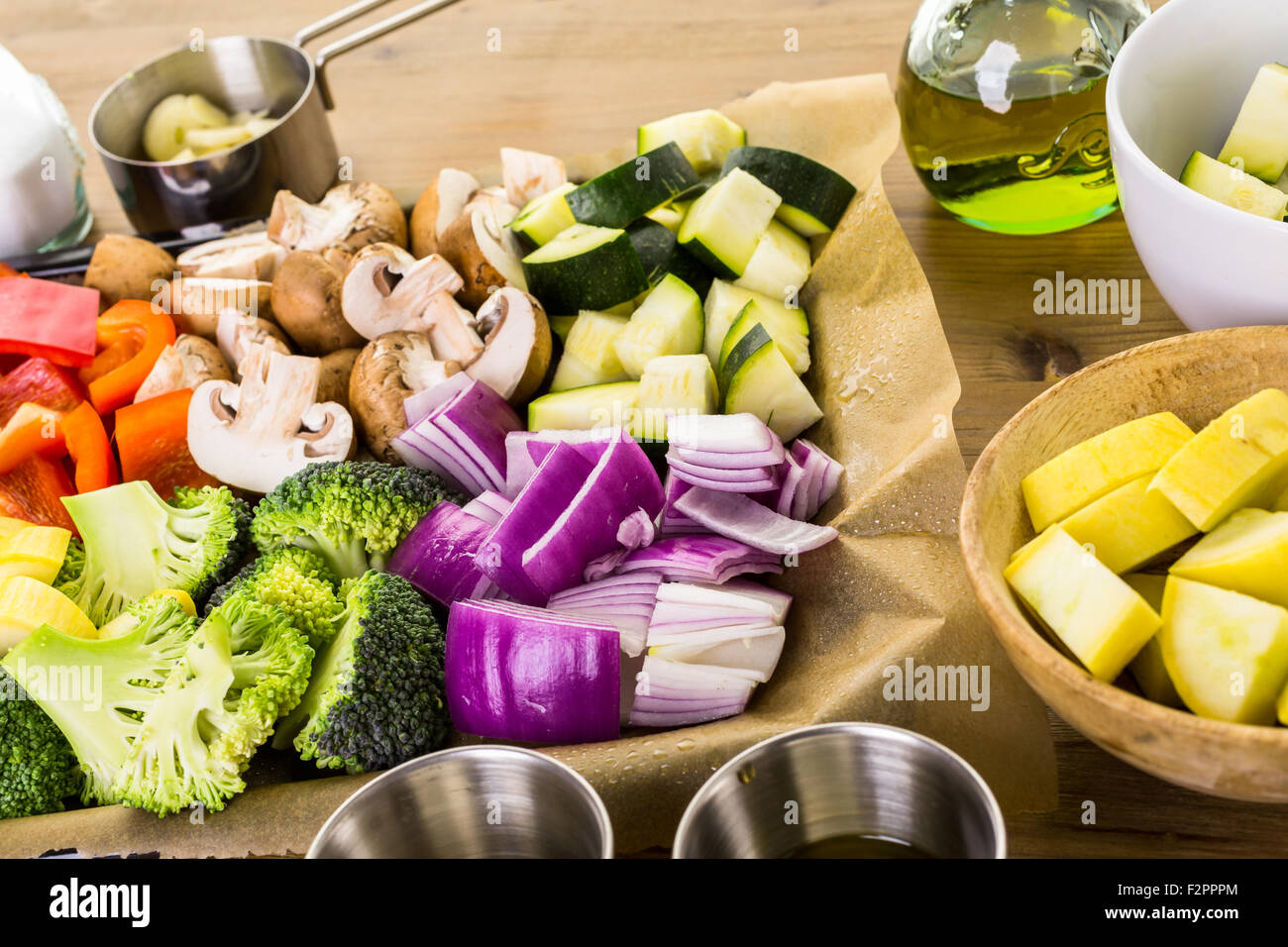 Fresh ingredients for preparing roasted mixed vegetables on the table ...