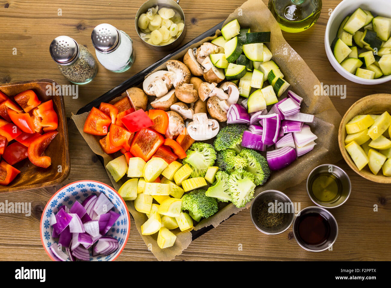 Fresh ingredients for preparing roasted mixed vegetables on the table ...