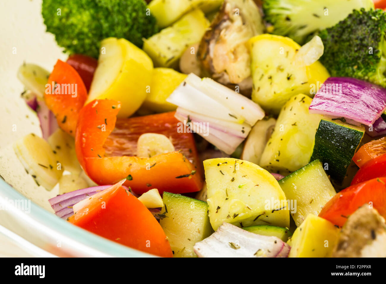Preparing fresh roasted mixed vegetables for dinner Stock Photo - Alamy