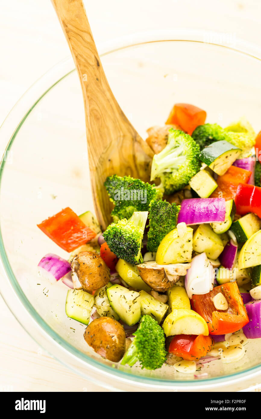 Preparing fresh roasted mixed vegetables for dinner Stock Photo - Alamy