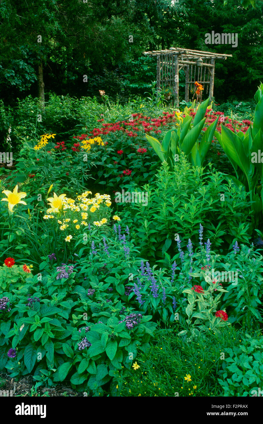 Cedar garden arbor in blooming summer garden, Missouri USA Stock Photo ...