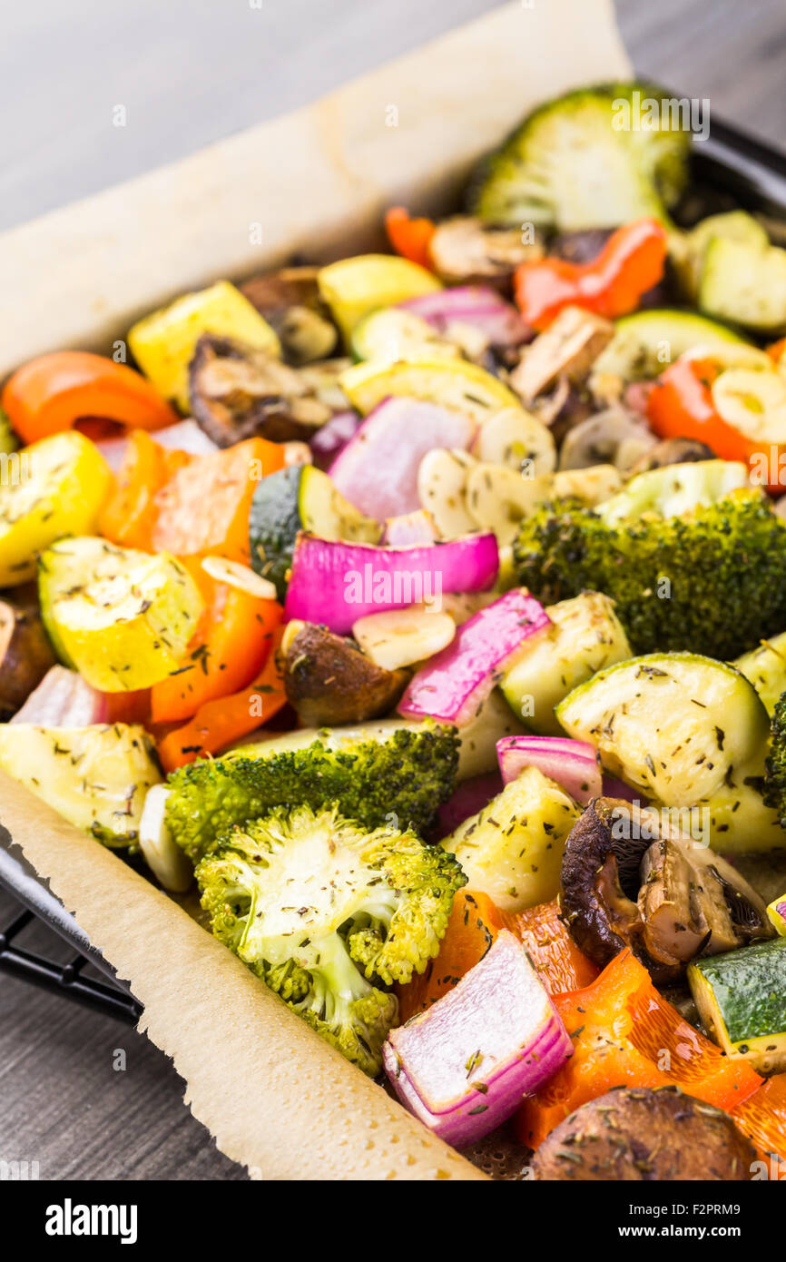 Preparing fresh roasted mixed vegetables for dinner Stock Photo - Alamy