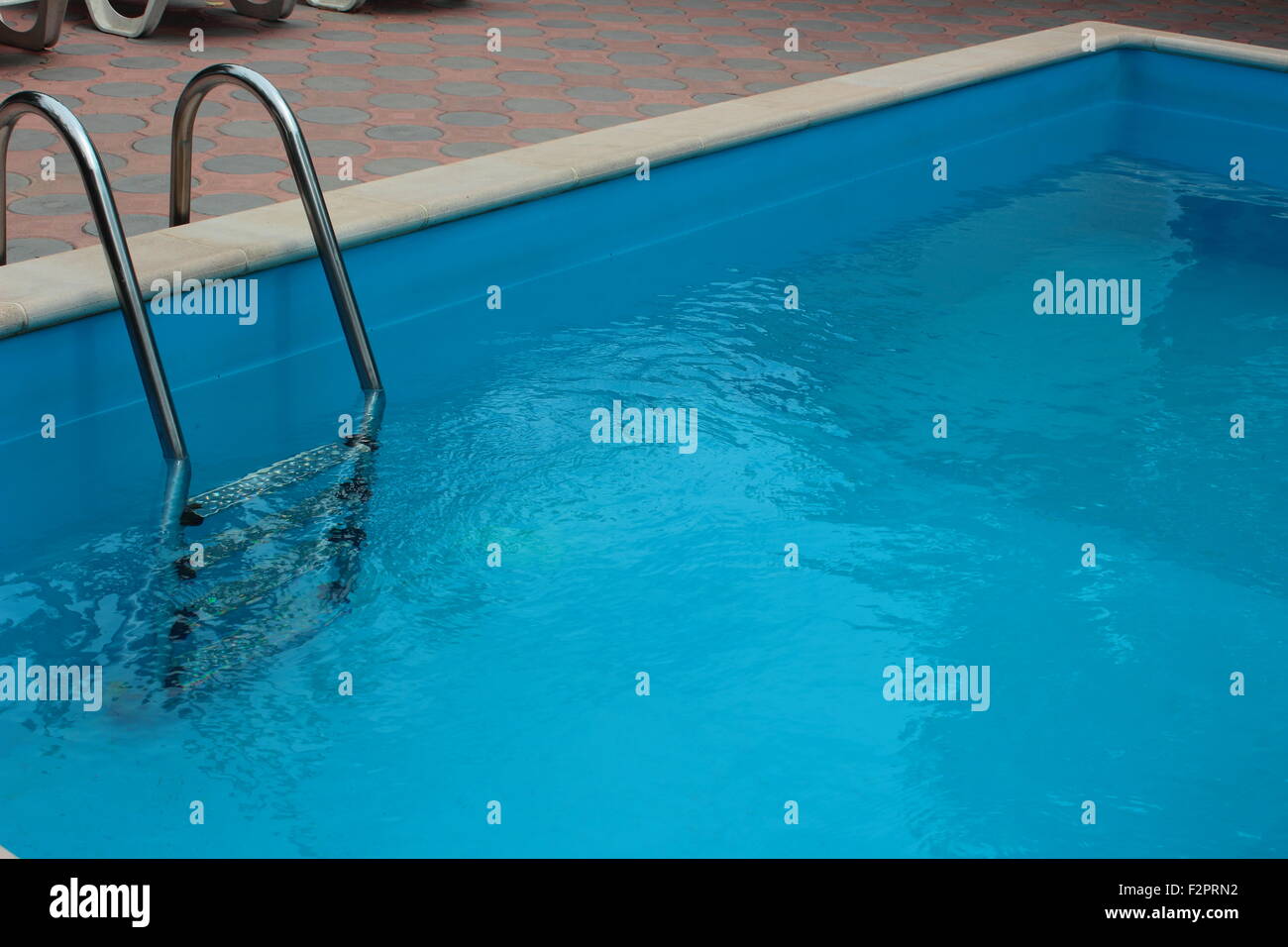 outdoor swimming pool with a ladder Stock Photo - Alamy