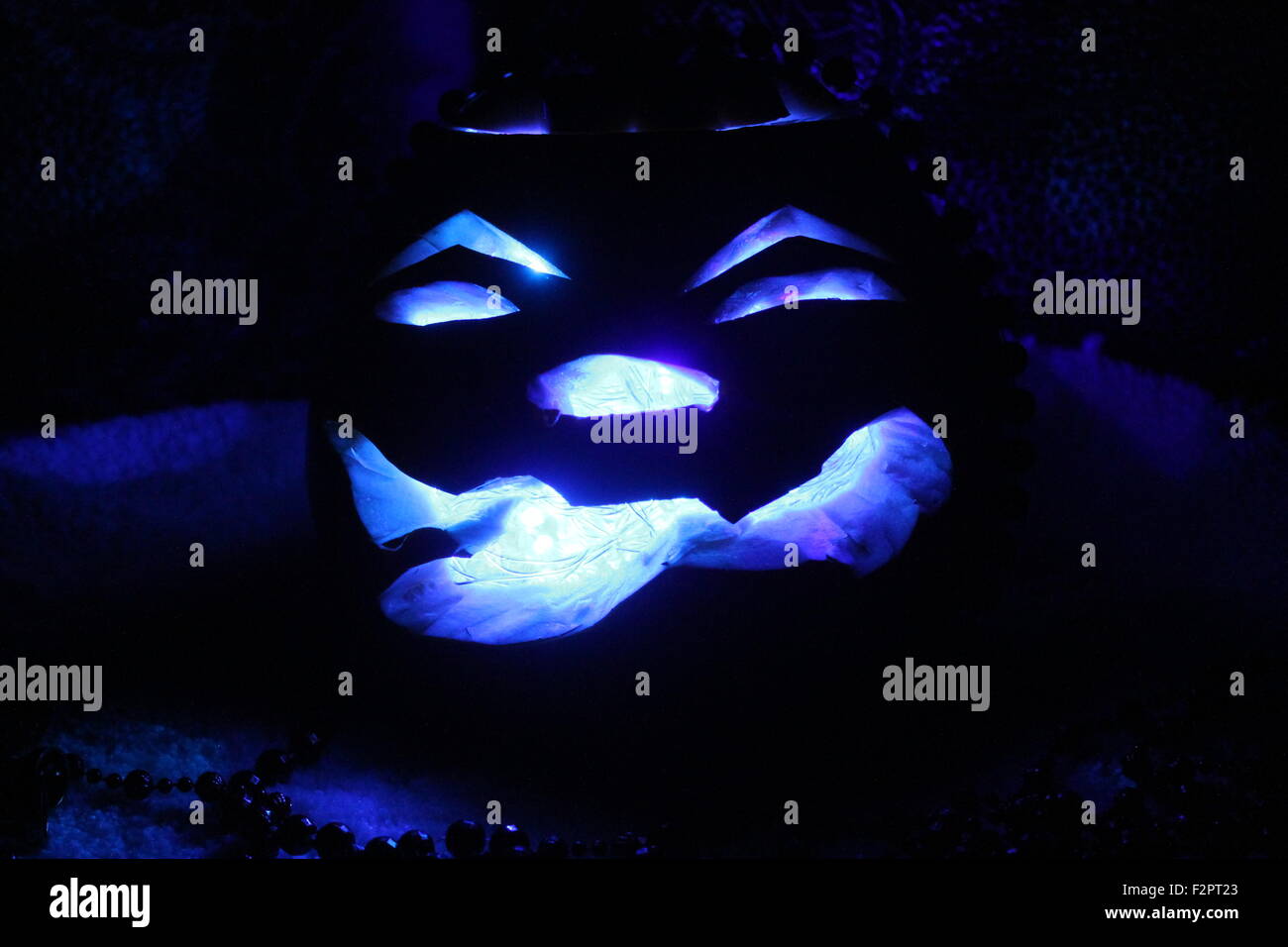 bright shine blue light lantern from ripe pumpkin for celebration ...