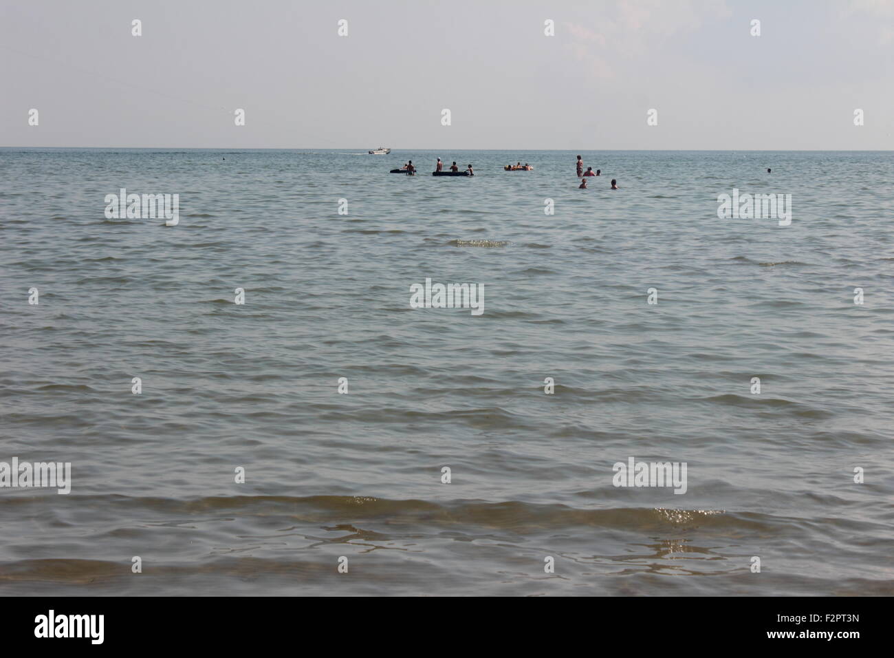 wonderful warm sea and bathing people Stock Photo - Alamy