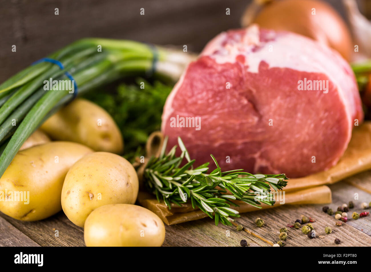 Organic pork lion roast with rosemary on wood farm table Stock Photo ...