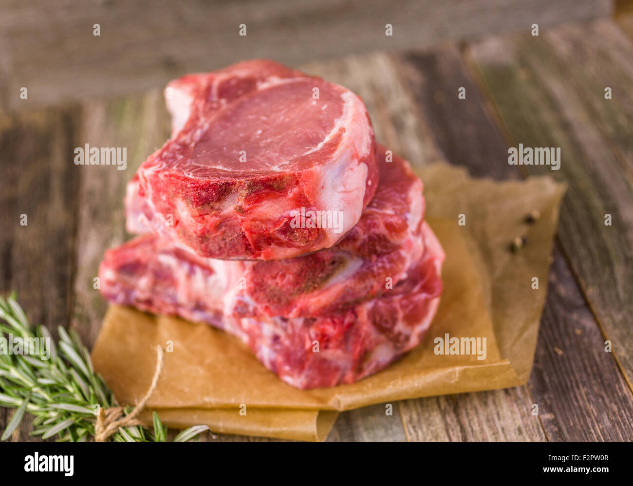 Organic pork lion chops of thick cut with rosemary Stock Photo - Alamy