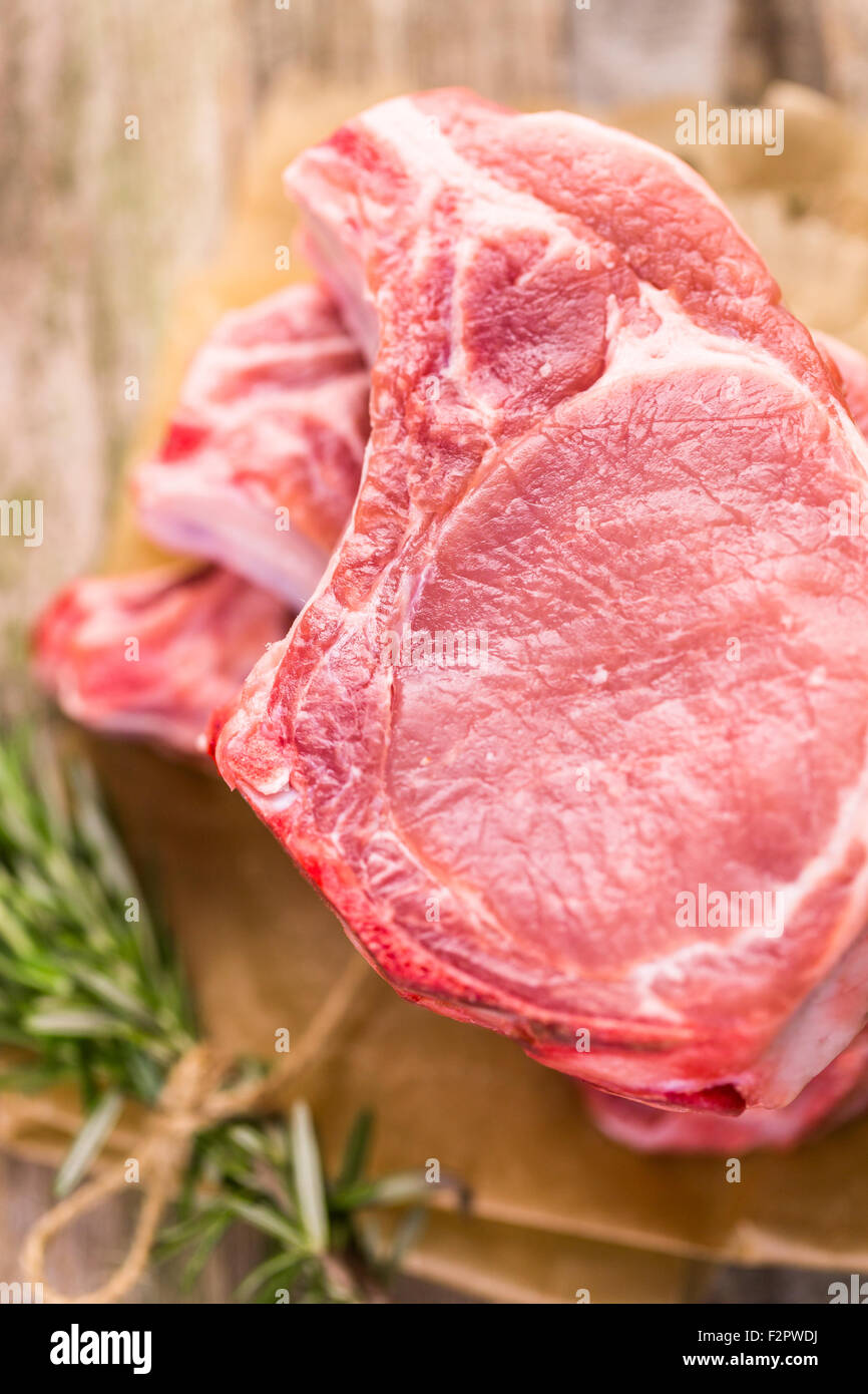Organic pork lion chops of thick cut with rosemary Stock Photo - Alamy