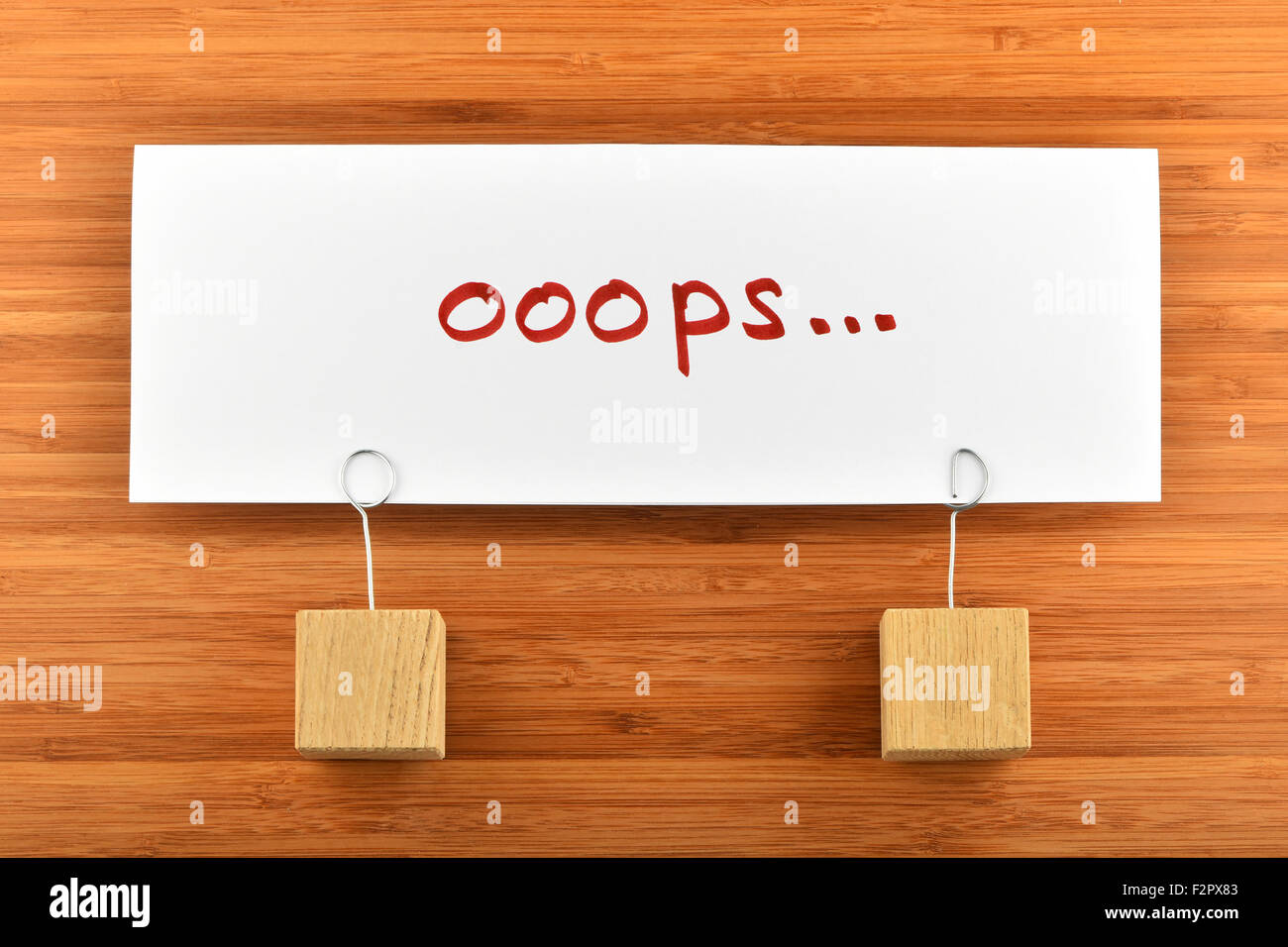 Oops, looks we have problem, one big white paper note with two wooden ...