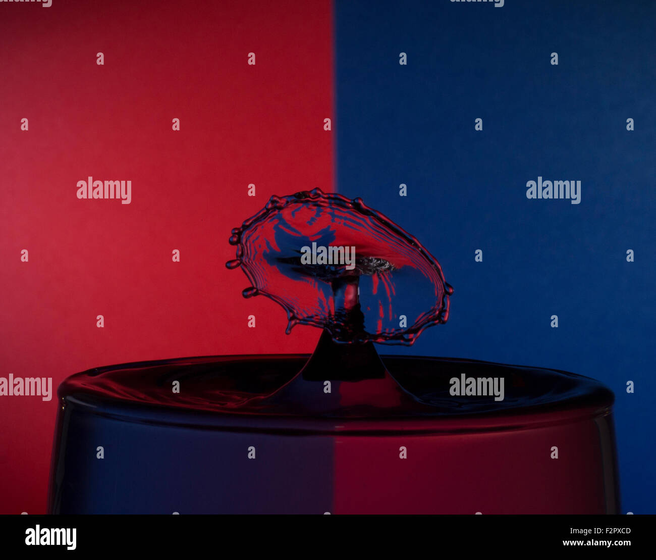 Water drop splash, two pieces of card, two flashes each side of the ...