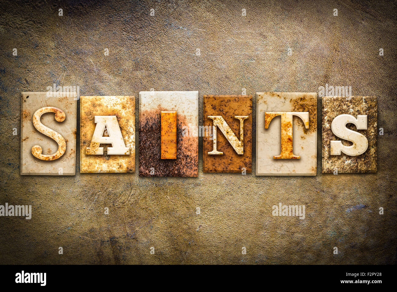 The word "SAINTS" written in rusty metal letterpress type on an old ...