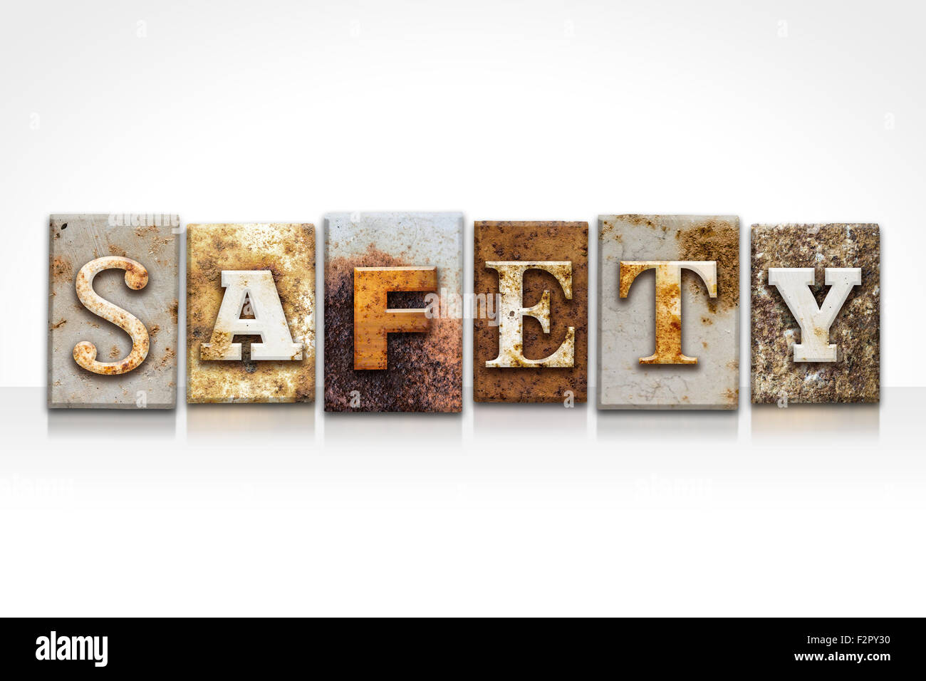 The word "SAFETY" written in rusty metal letterpress type isolated on a ...