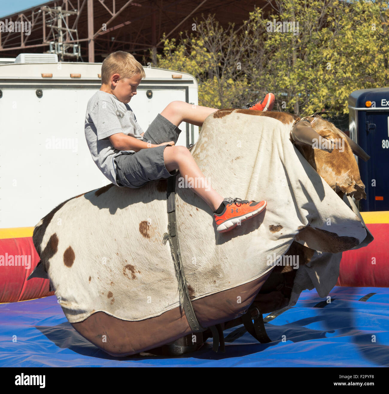 Hutchinson, Kansas 9-13-2015 Young boy shows off his rodeo skills on a ...